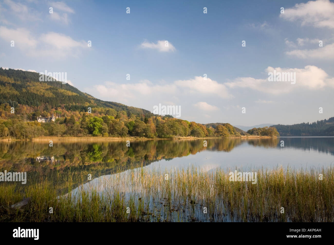 Autumn view across Loch Achray to the former Trossachs Hotel now Tigh ...