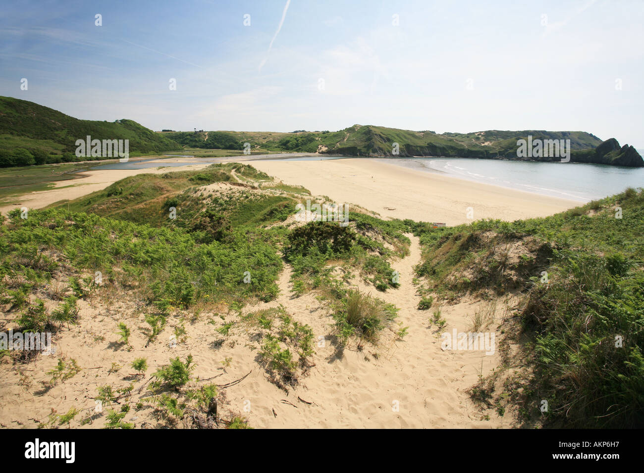 Golden sand dunes of Penmaen Burrow overlooking Three Cliffs Bay Gower ...