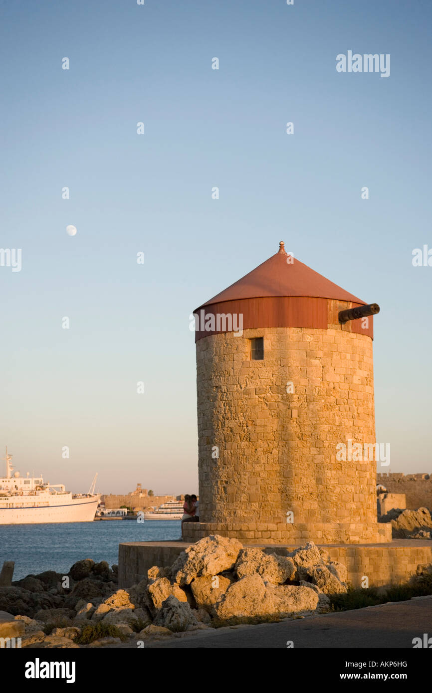 Traditional windmill on mole at Mandraki harbour translated literally ...