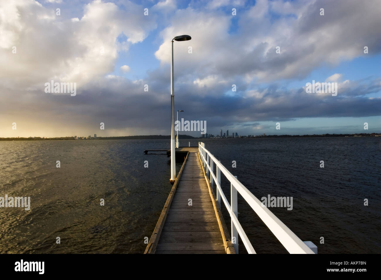 A jetty stretching out into the Swan River, Perth. The city's ...