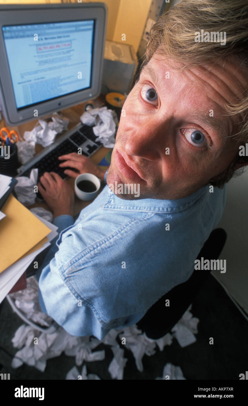 Man Stressed and Overwhelmed with Work at Computer in Office Stock ...