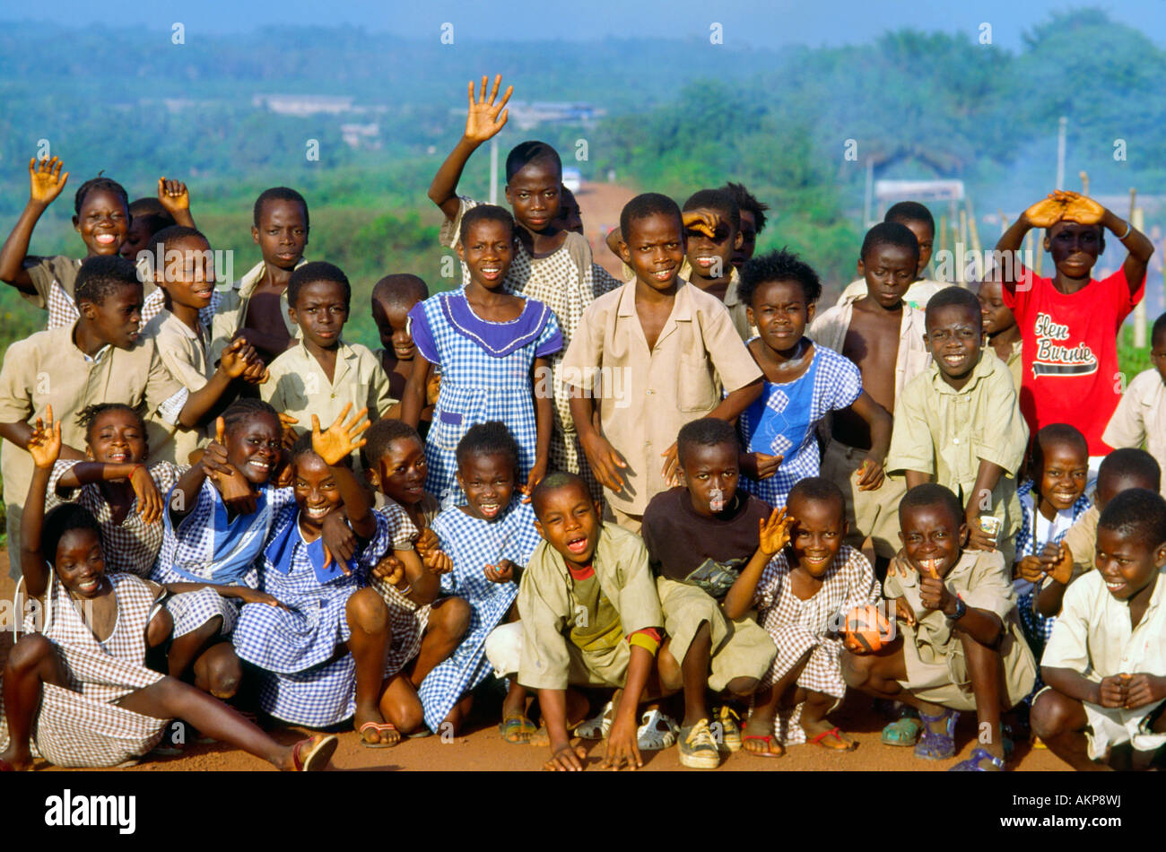A lively group of school children pose in a group in Tabou Cote d ...