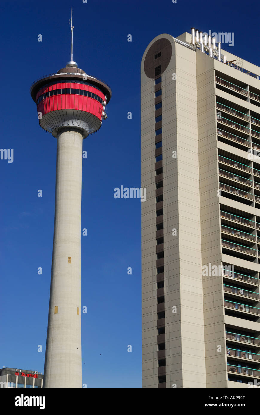 Calgary Tower with apartment building highrise and hotel on a clear ...