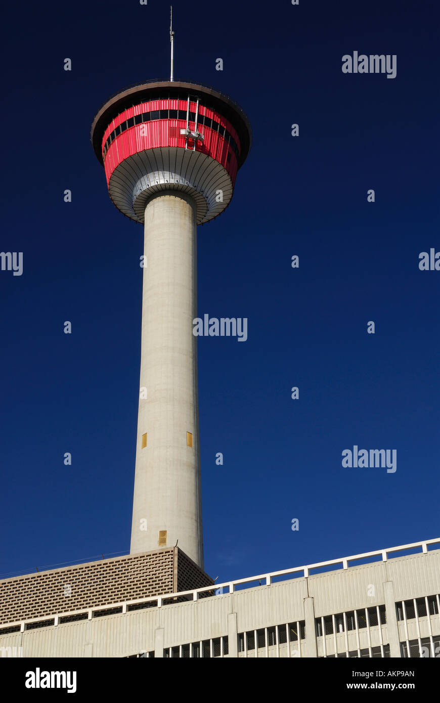 Calgary Tower against a deep blue sky with concrete building Alberta ...