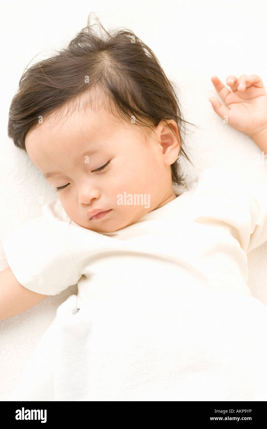 Asian man sleeping Cut Out Stock Images & Pictures - Alamy