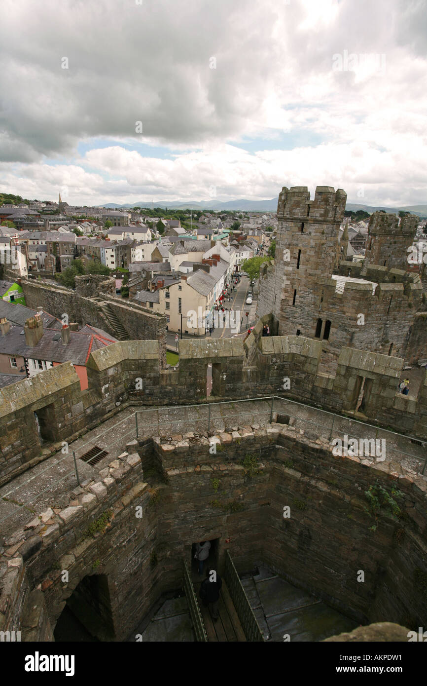 Aerial view of fortified stone walls towers embattlements of Caernarfon ...