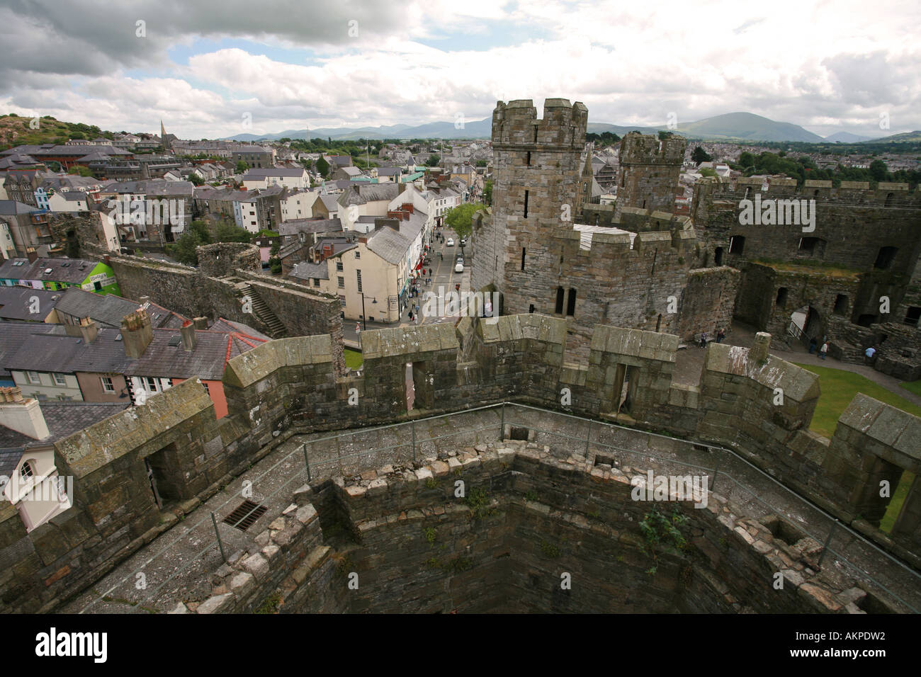 Aerial view of fortified stone walls towers embattlements of Caernarfon ...