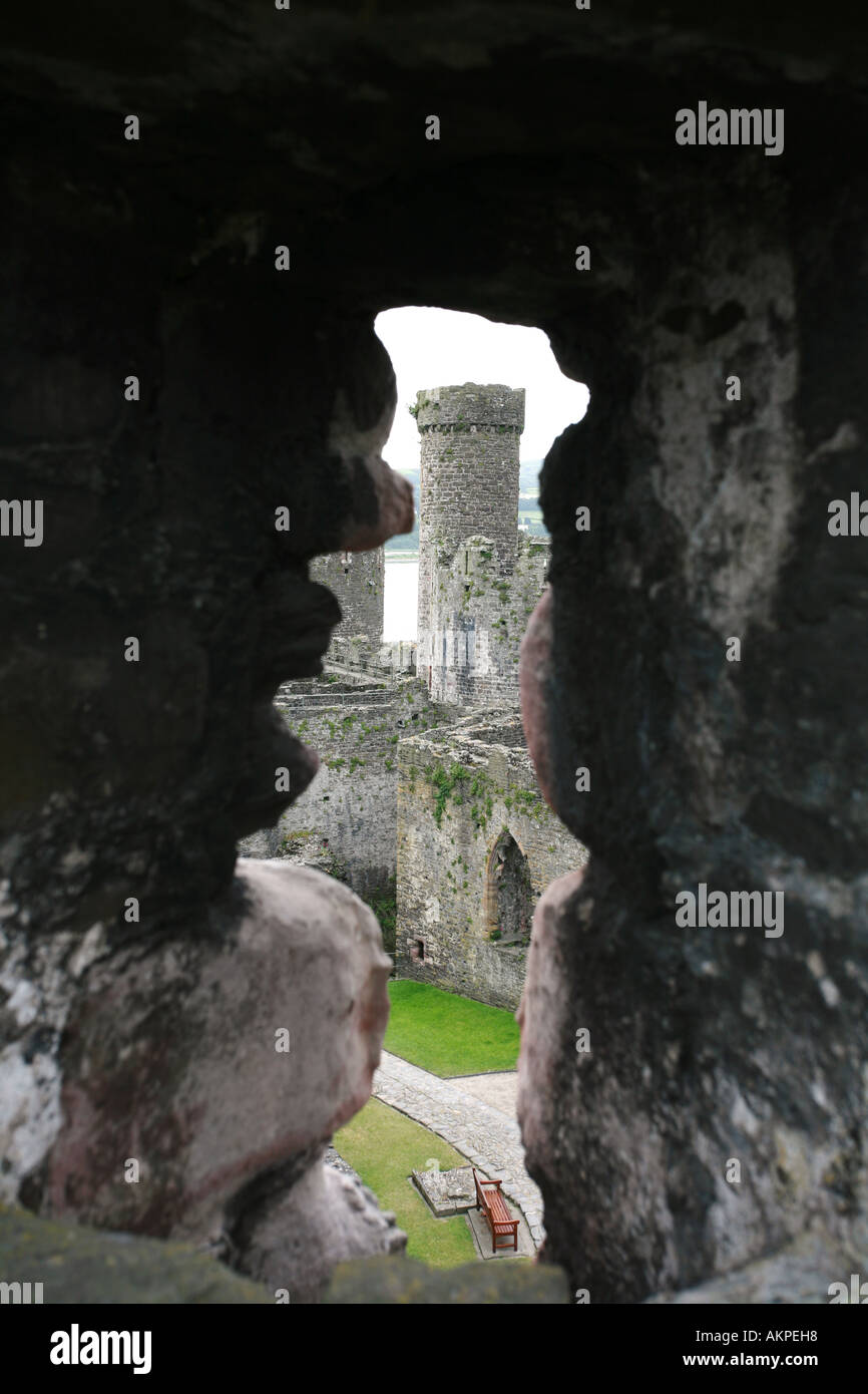 View through a medieval stone arrow whole window at famous Conwy Castle ...