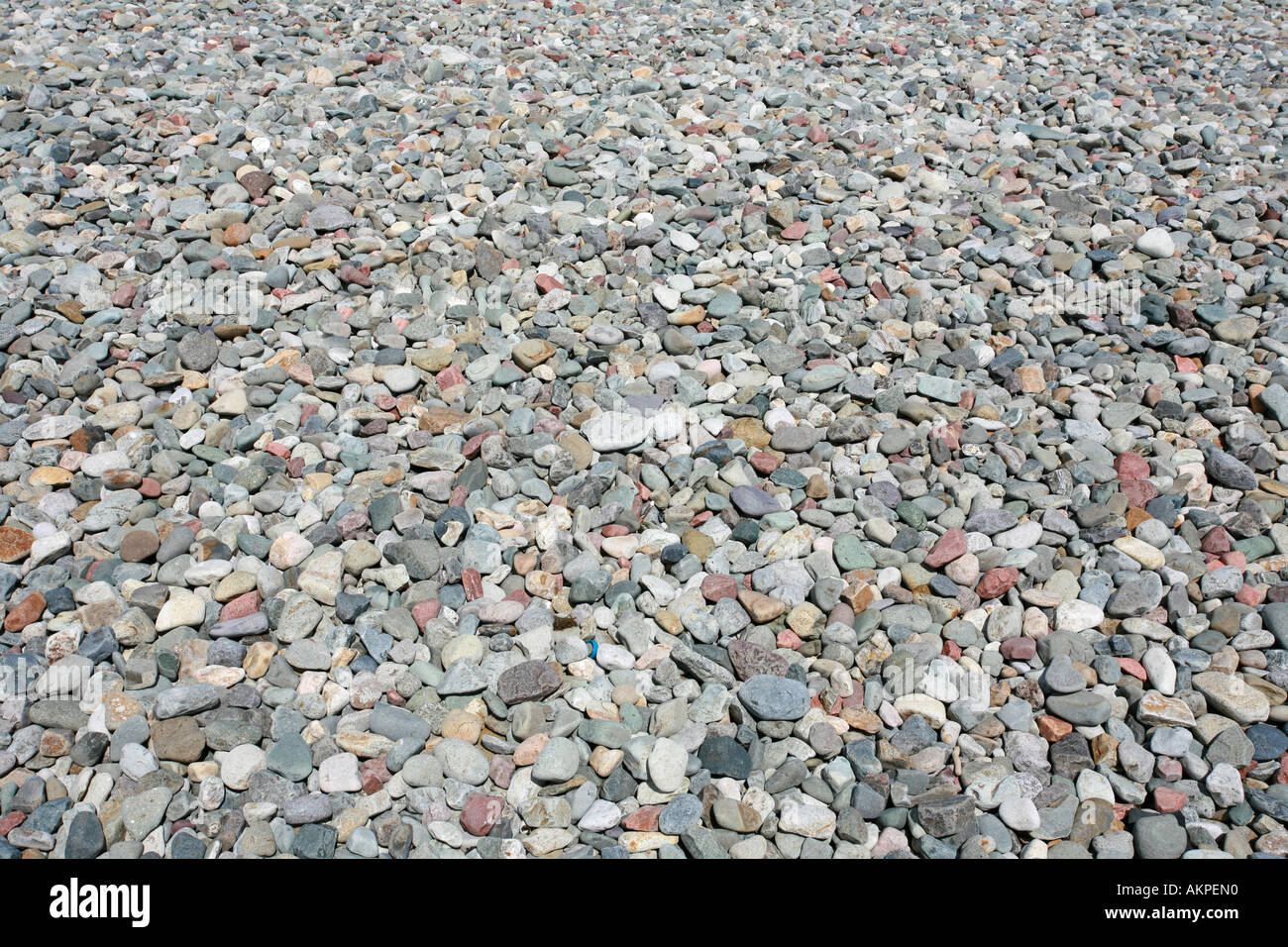 multi coloured pebbles stones on a beach ideal graphic background image ...