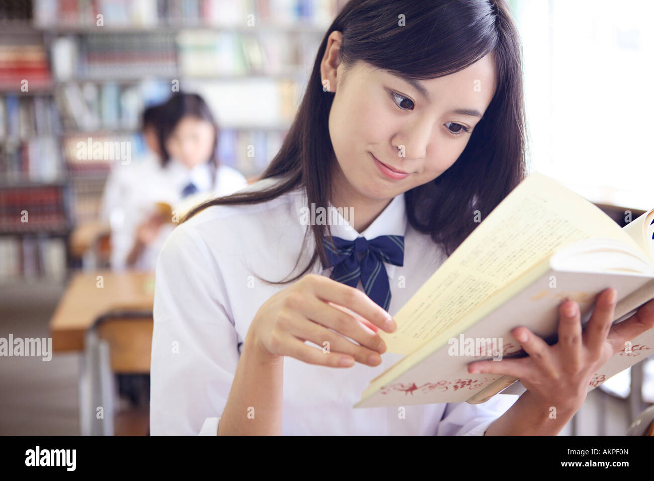 High school student in a library Stock Photo - Alamy