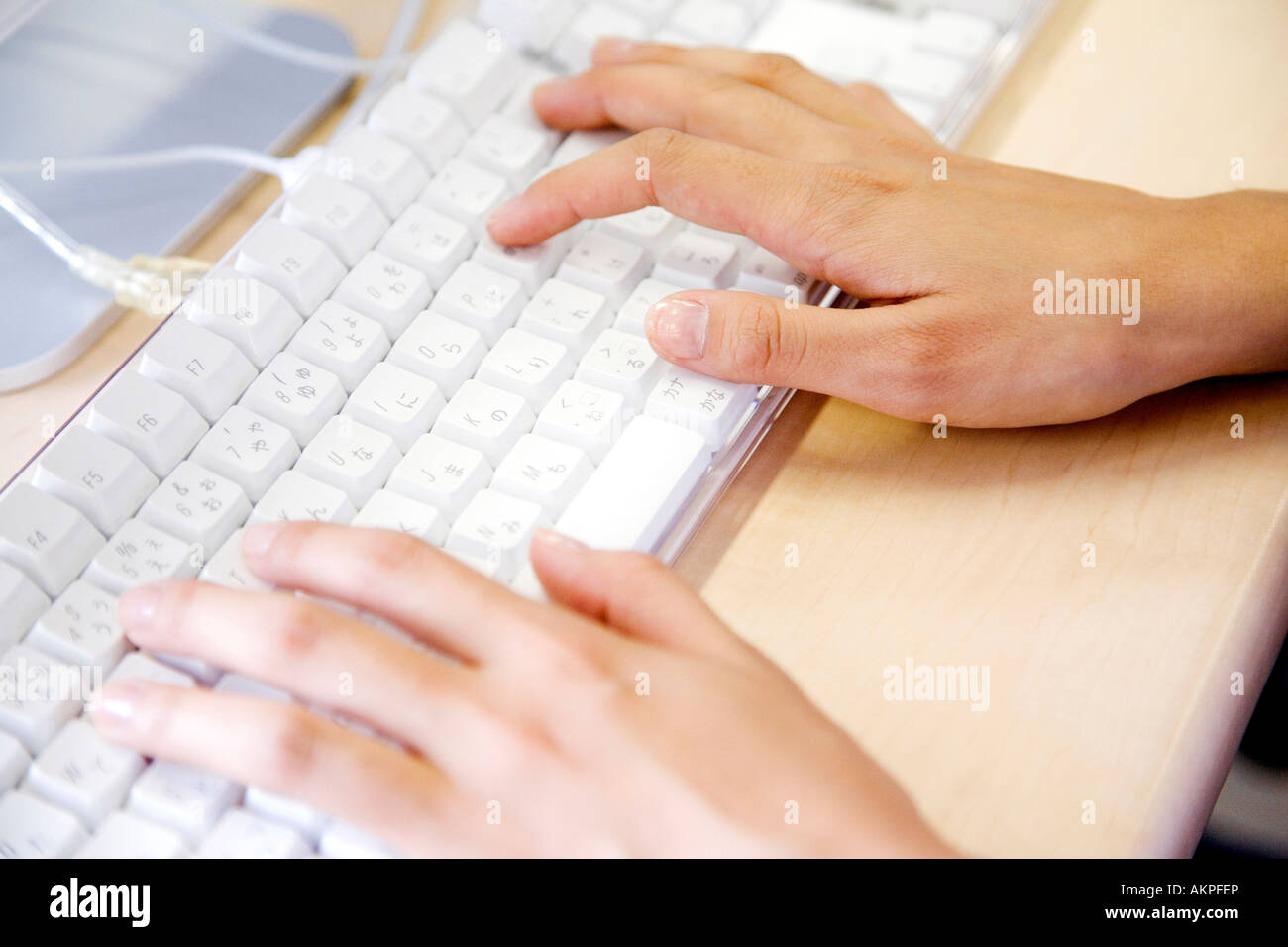 Hands operating keyboard Stock Photo - Alamy