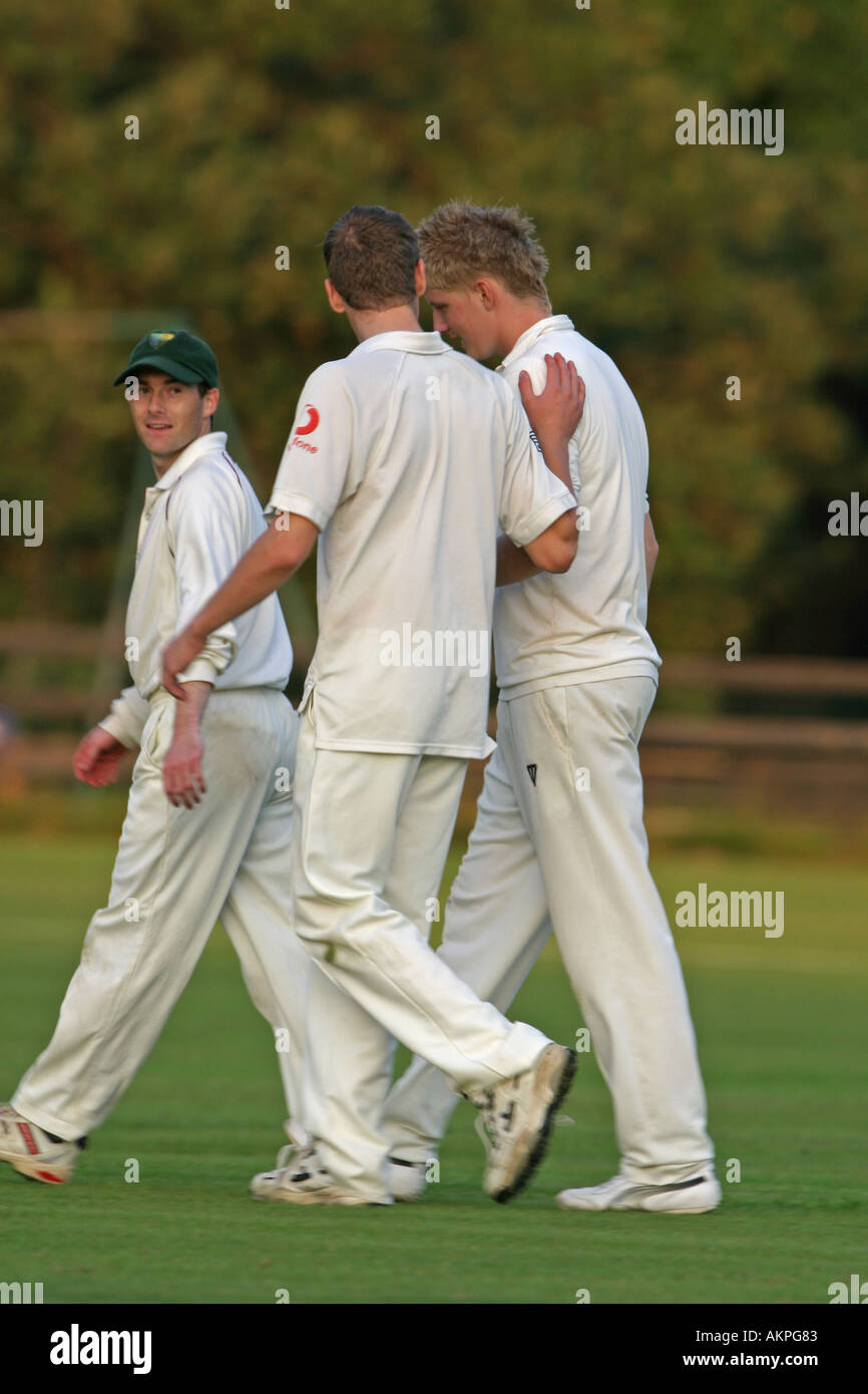 team mate congratulating another member of the team during a cricket ...