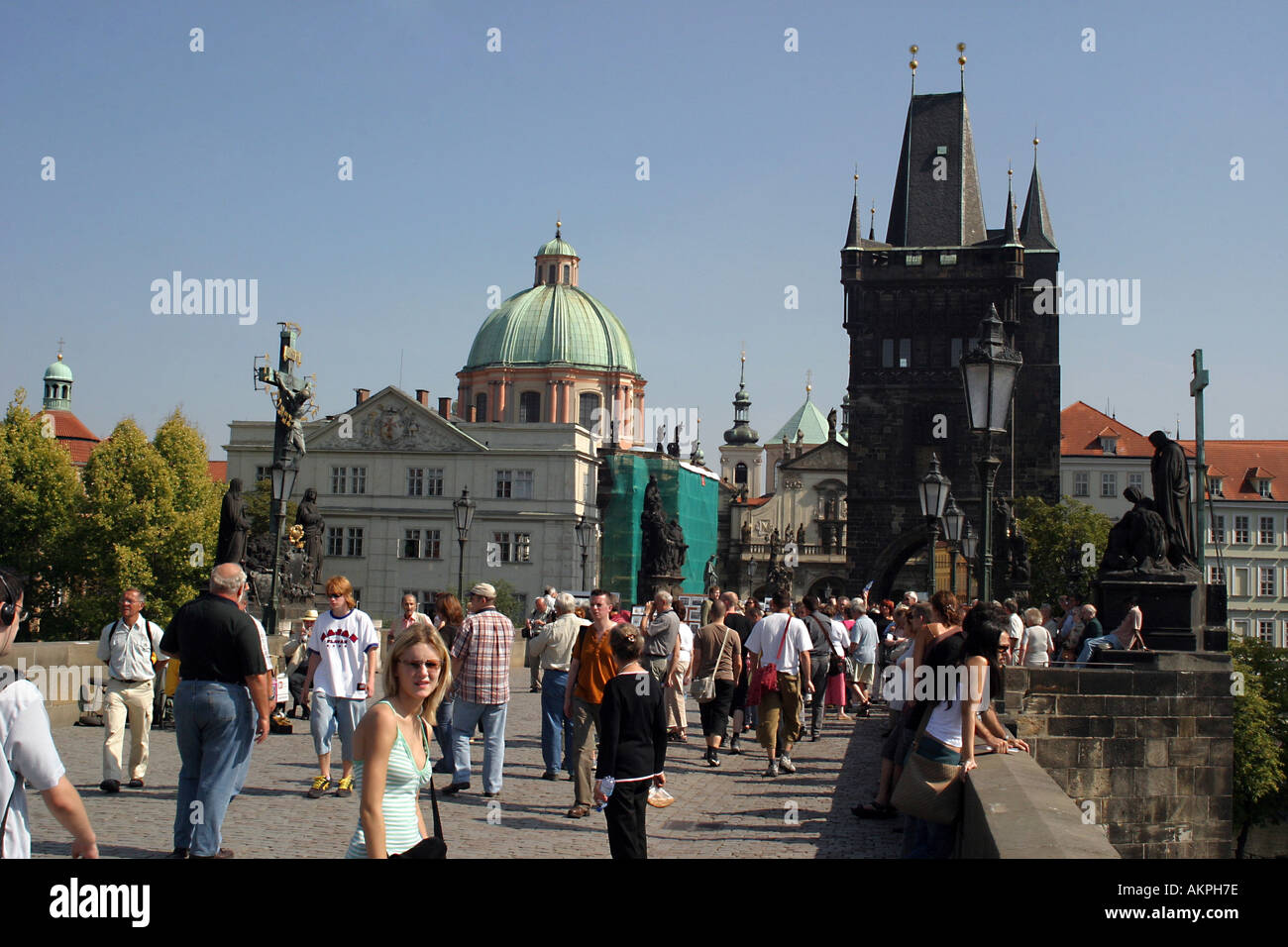 Charles Bridge at midday in Prague, Czech Republic showing the crowds ...