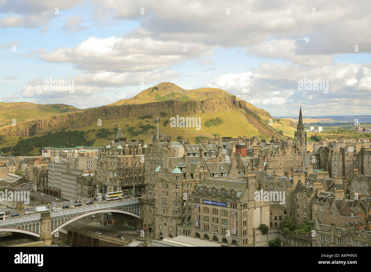 The north bridge in the city centre of Edinburgh with Arthur's seat in ...