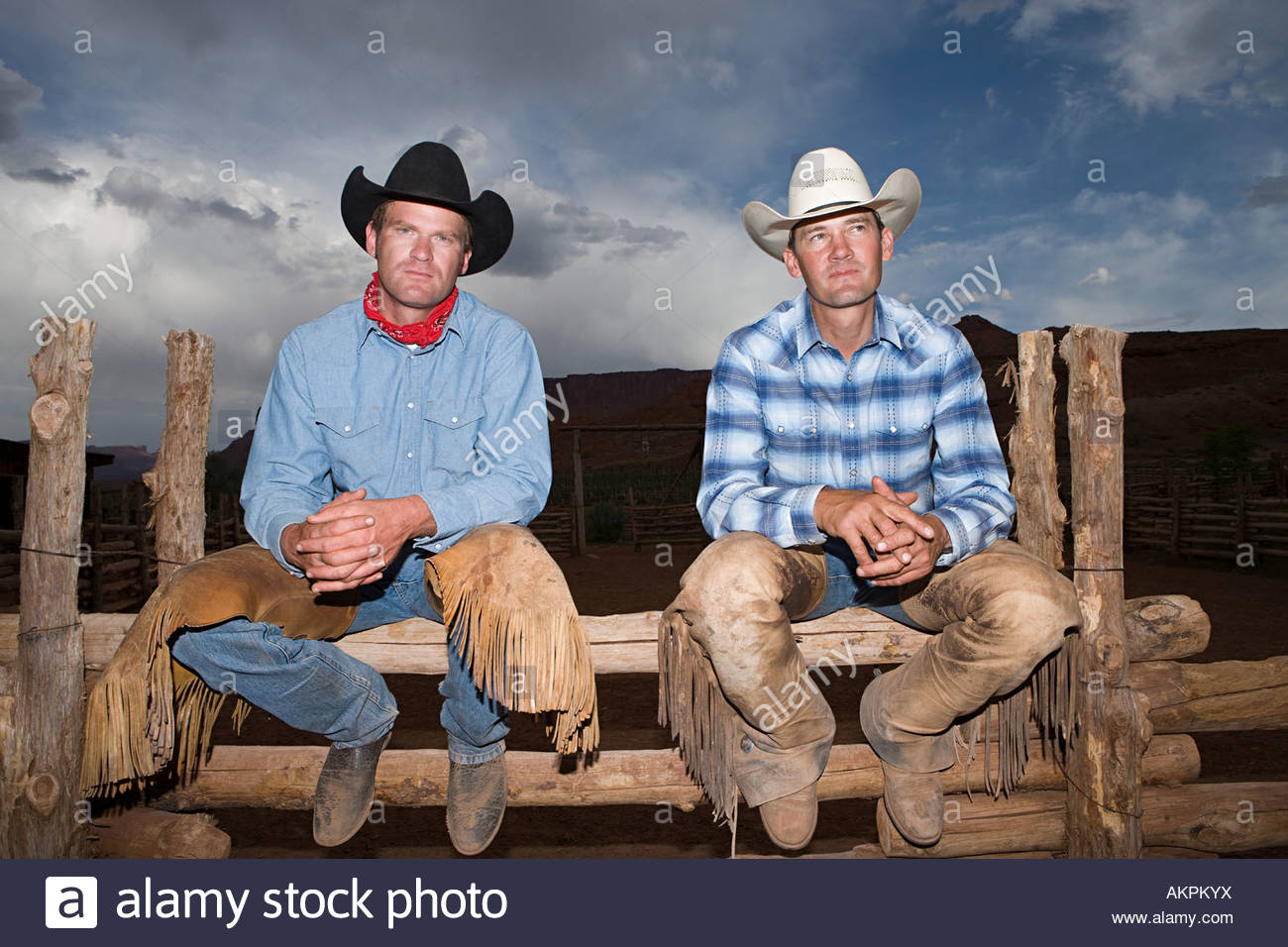Cowboys sitting on fence Stock Photo, Royalty Free Image: 15053245 - Alamy