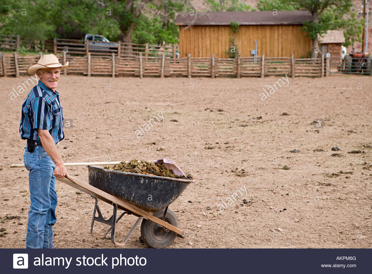 Man With Wheelbarrow Stock Photos & Man With Wheelbarrow Stock Images ...
