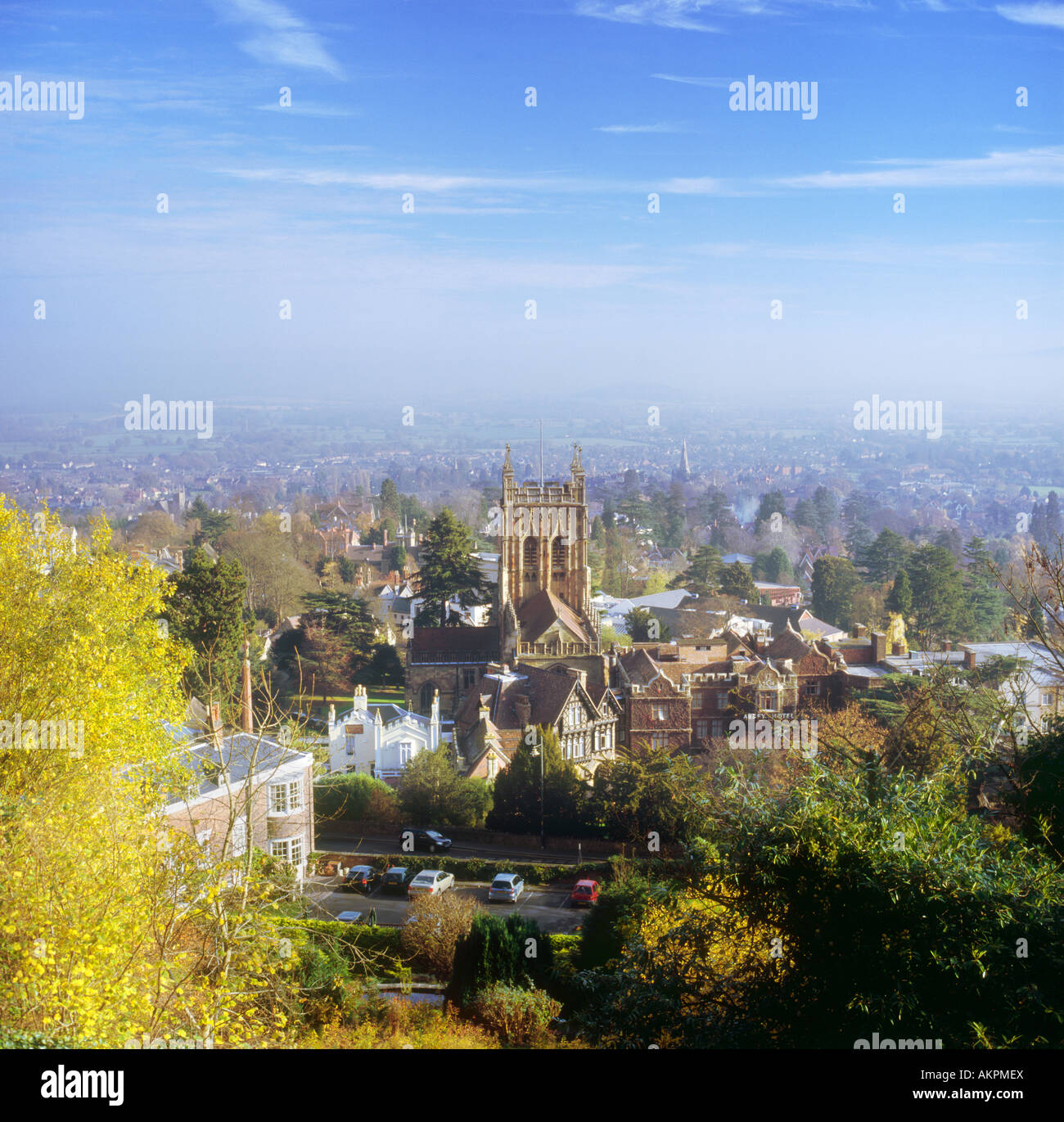 Great Malvern town and priory on clear day with fog in distance ...