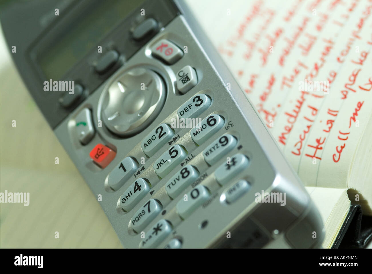 Cordless telephone on top of a diary Stock Photo - Alamy