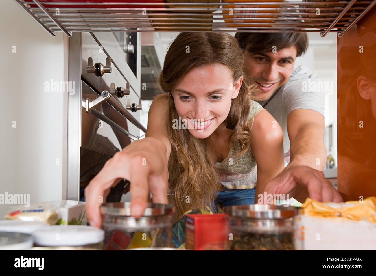 Reaching into cupboard hi-res stock photography and images - Alamy