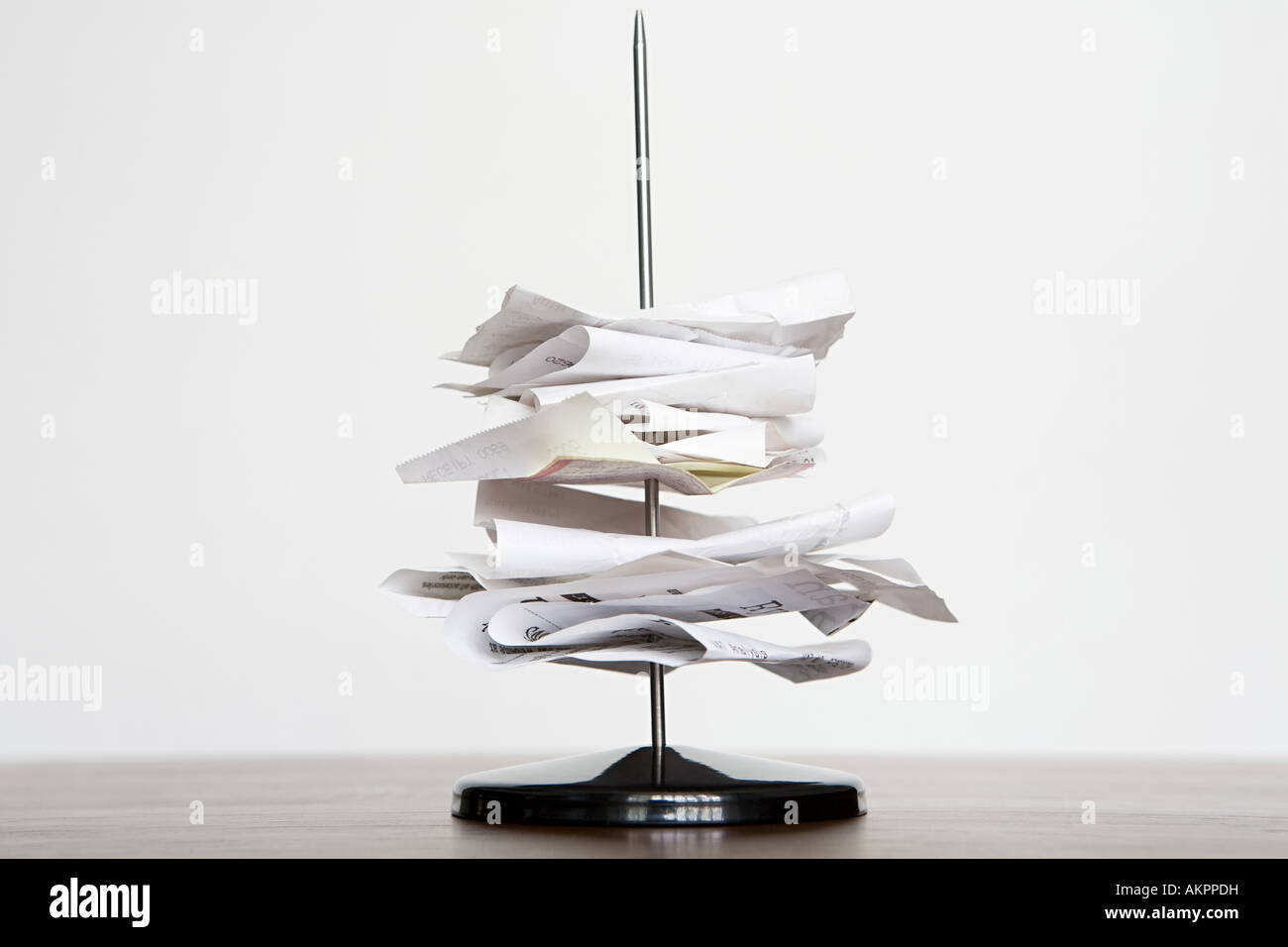 A letter spike with paper on it Stock Photo - Alamy