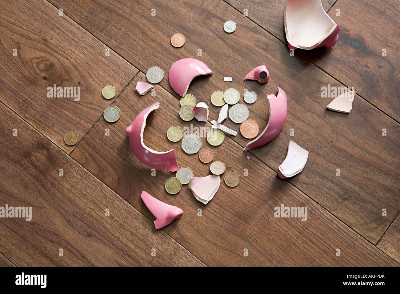 A smashed piggy bank Stock Photo - Alamy