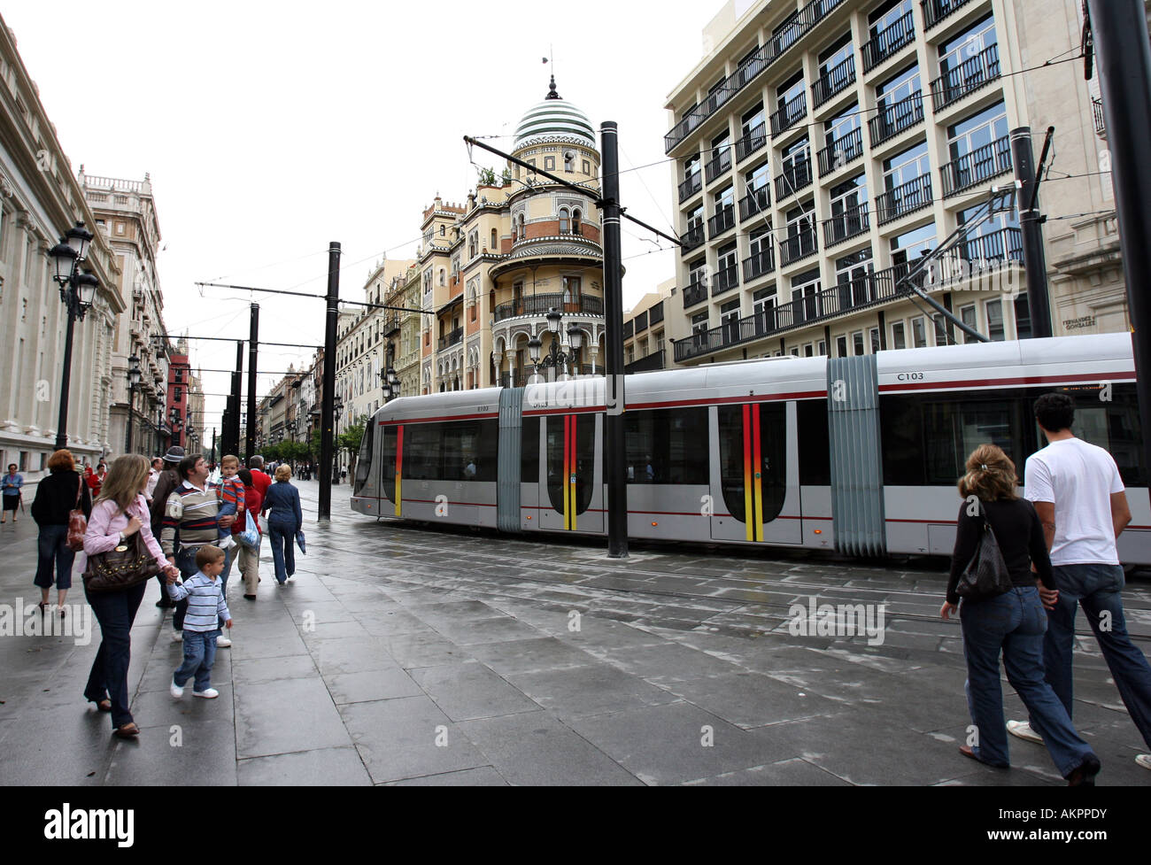 Light rail train going along Avenida de la Constitucion in Seville ...