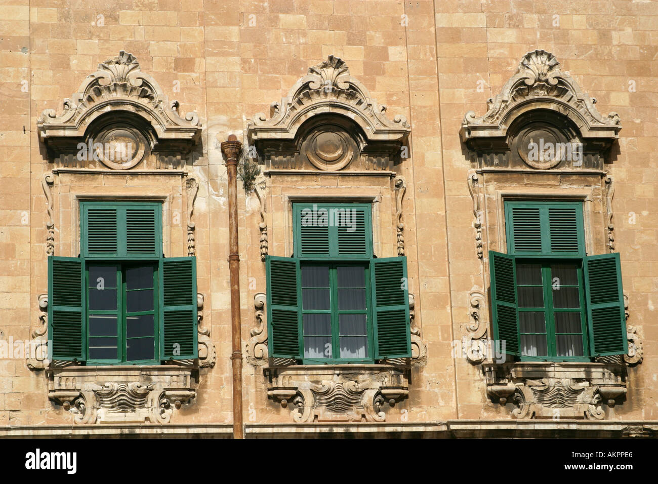 Three windows with shutters Stock Photo - Alamy