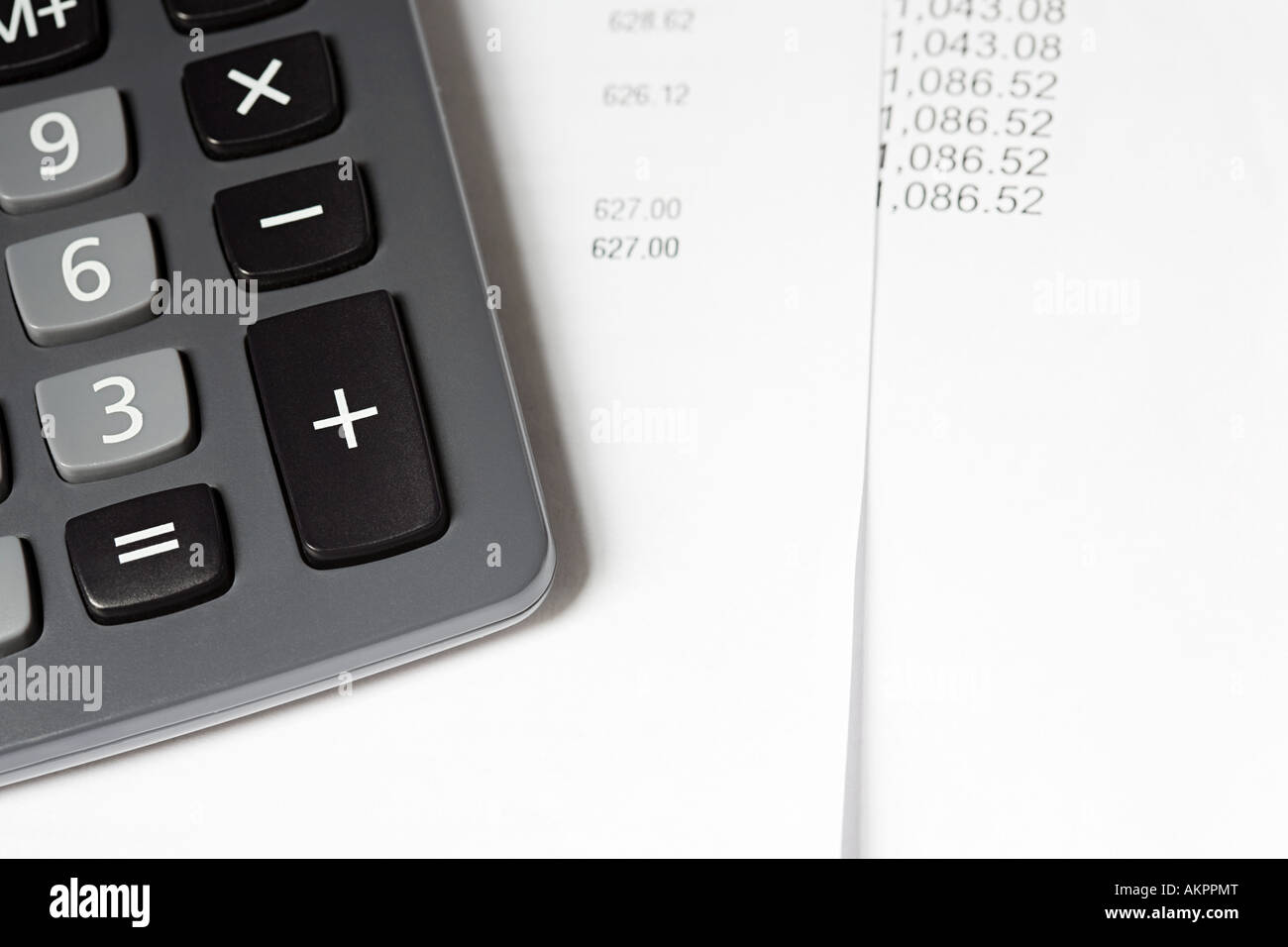 A calculator and paper work Stock Photo - Alamy