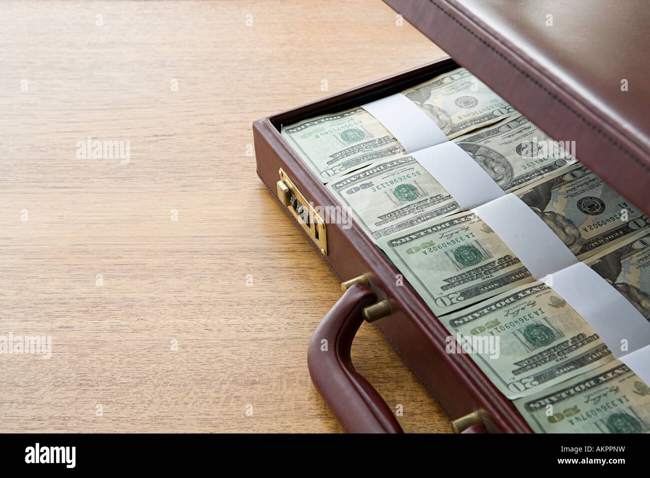 A briefcase filled wih banknotes Stock Photo - Alamy