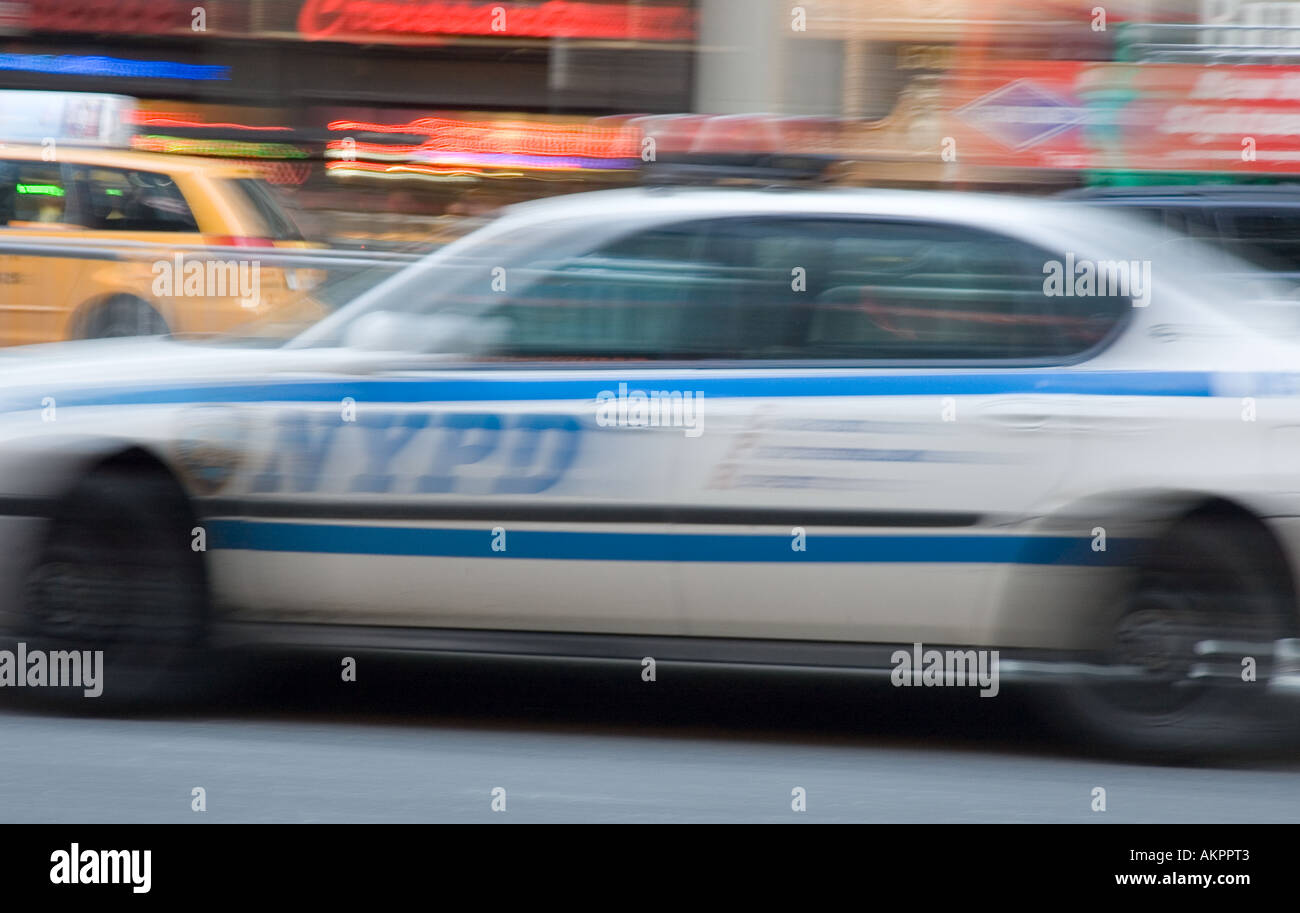 moving nypd cruiser in times square new york city Stock Photo - Alamy