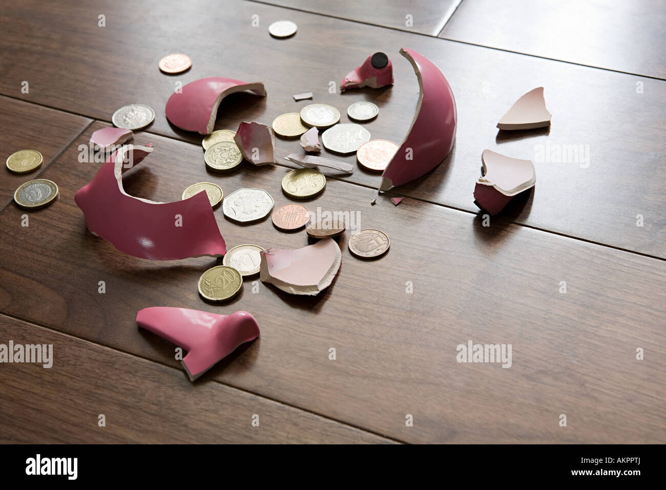 A smashed piggy bank Stock Photo - Alamy