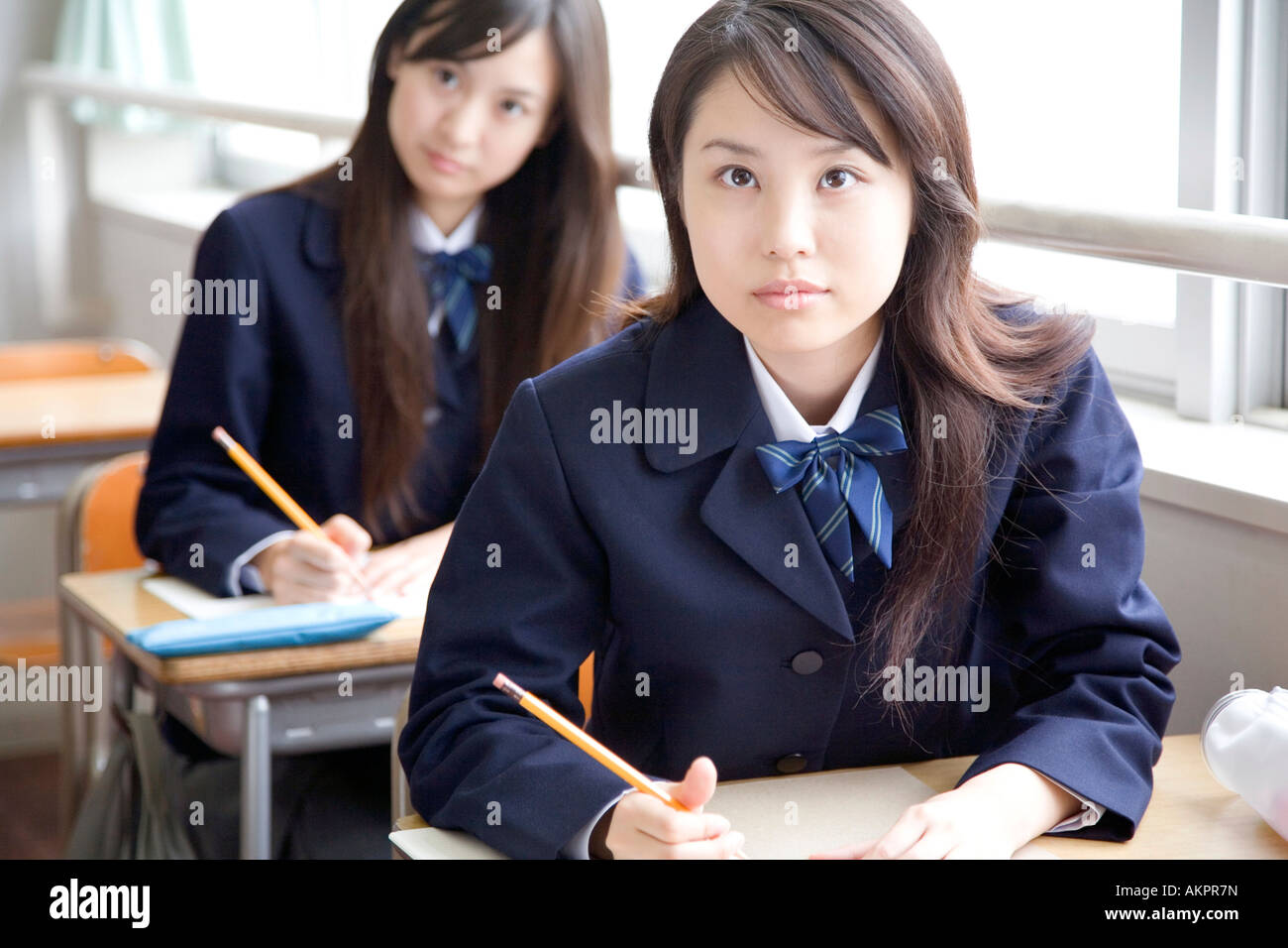 High school girl taking school lessons Stock Photo - Alamy
