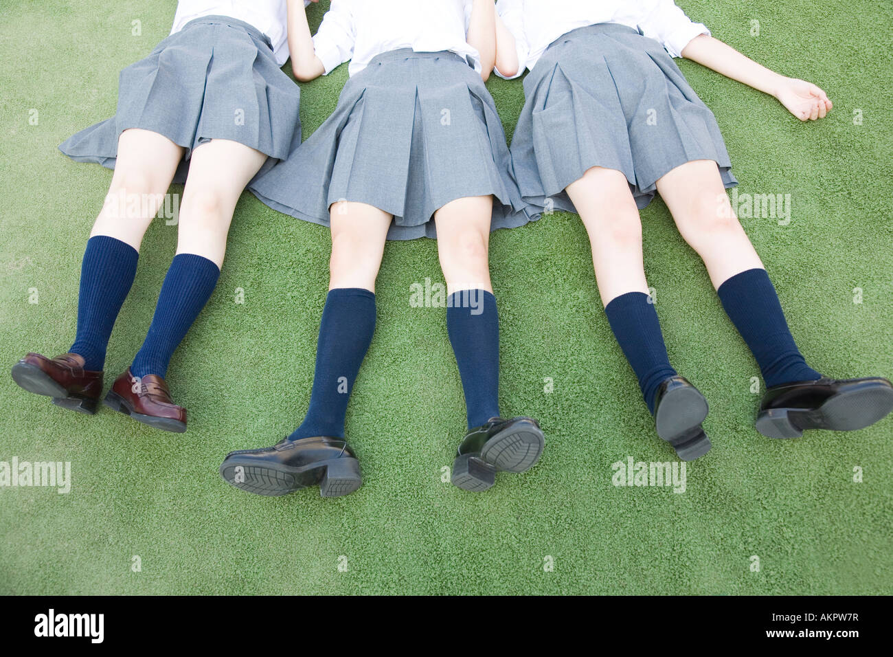 High school girls lying down Stock Photo - Alamy
