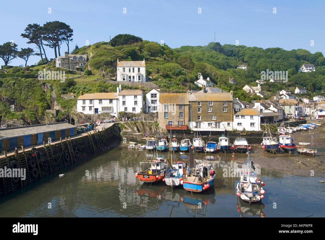 English coastal village in summer blue sky landscape & Cornish low tide ...