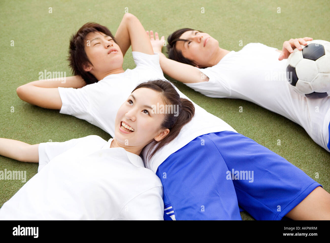 High school student lying down on a ground Stock Photo - Alamy