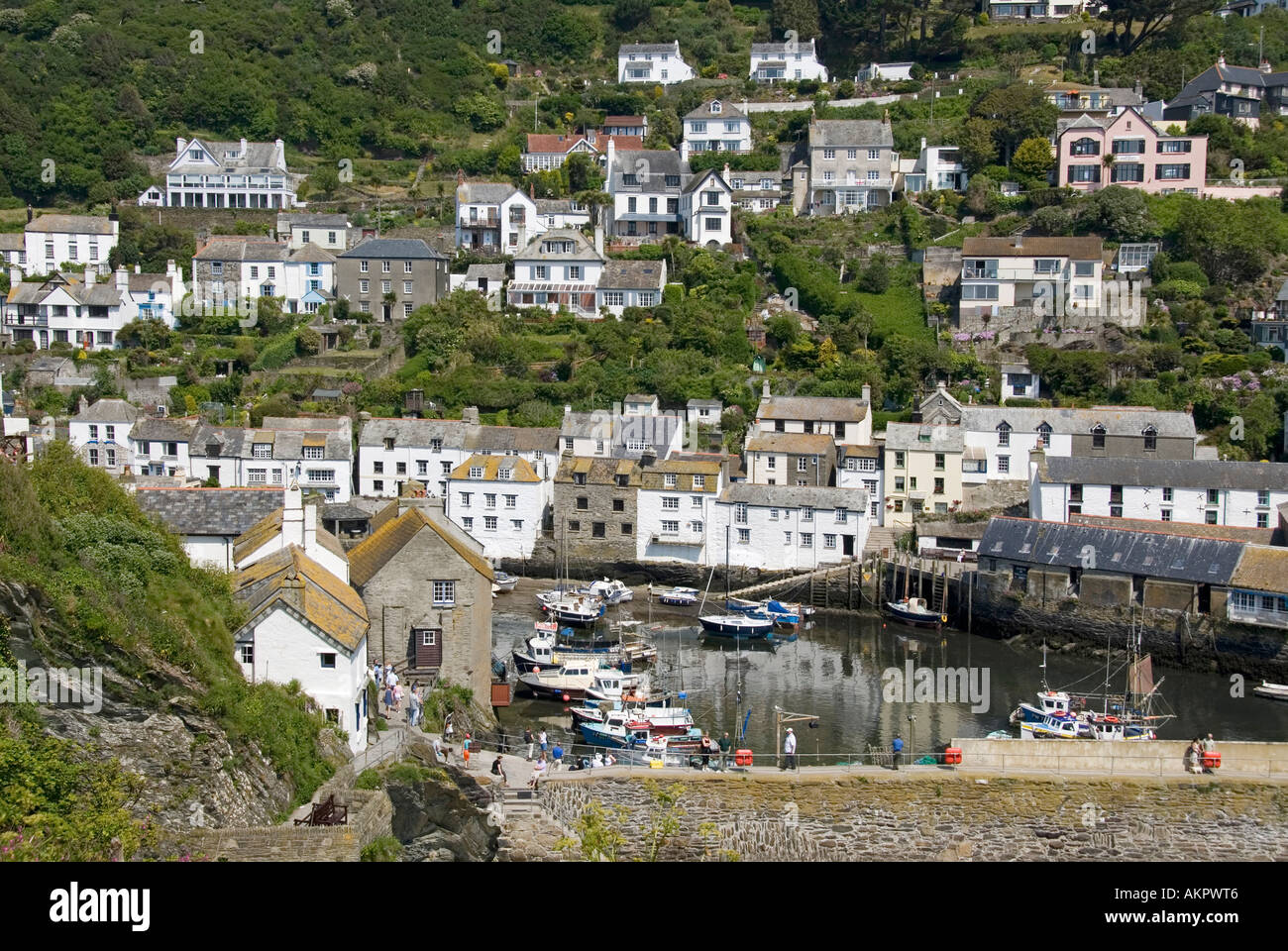 Aerial view looking down Cornish English village & harbour in valley of ...