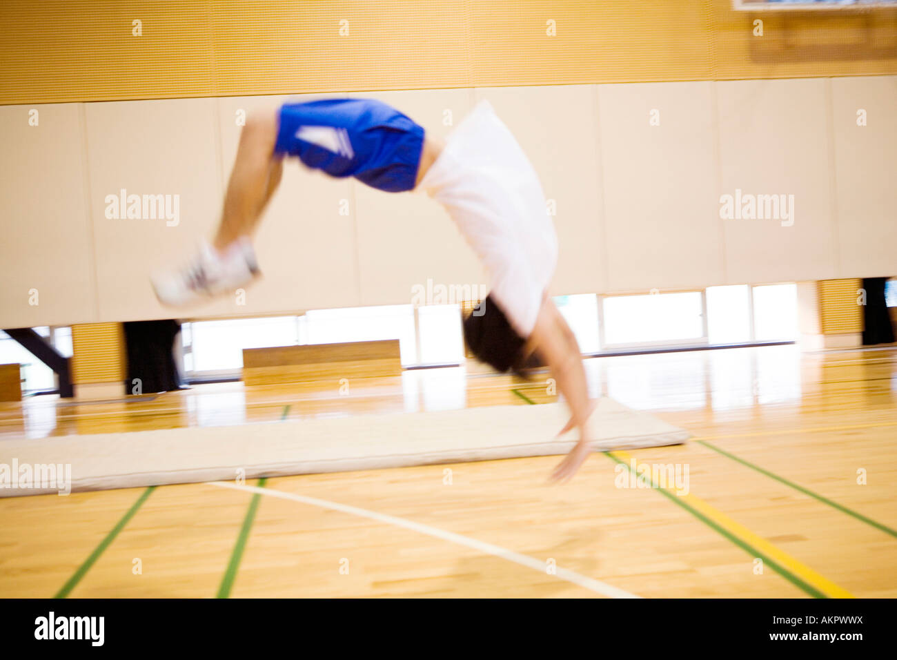 High school boy doing backflip Stock Photo - Alamy