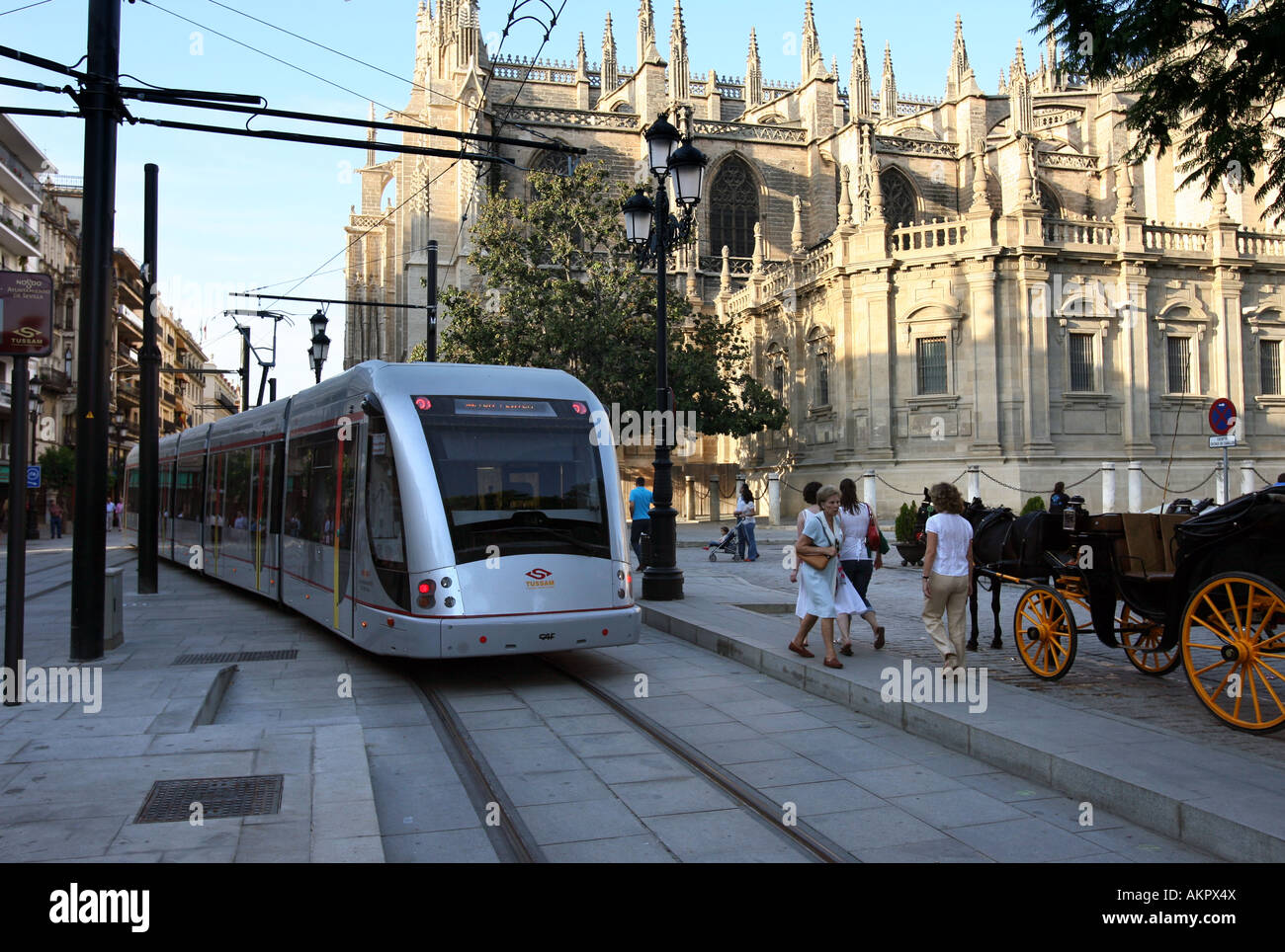 Light rail train going along Avenida de la Constitucion in Seville ...