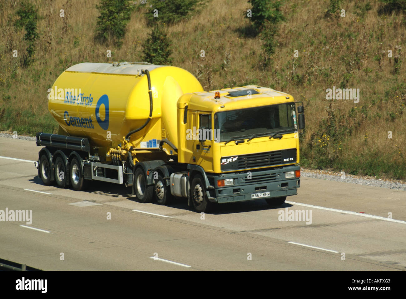 M25 motorway ERF lorry towing a Blue Circle Cement bulk tanker trailer ...