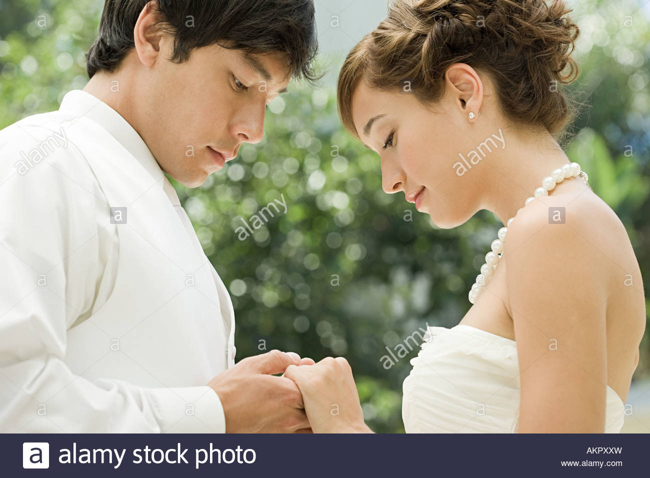 Wedding Couple Holding Hands Stock Photos & Wedding Couple Holding ...
