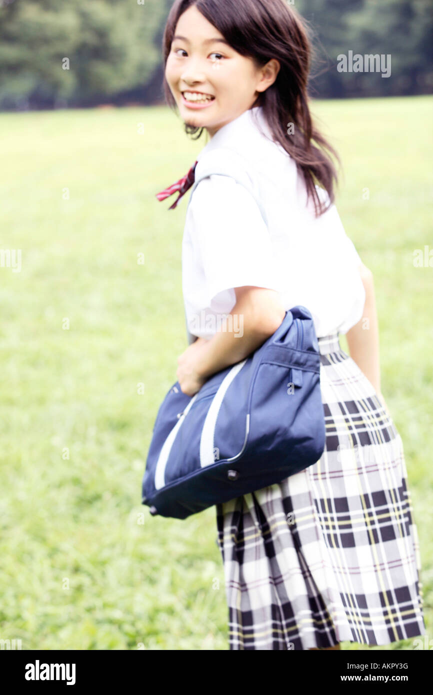 High school girl looking back Stock Photo - Alamy