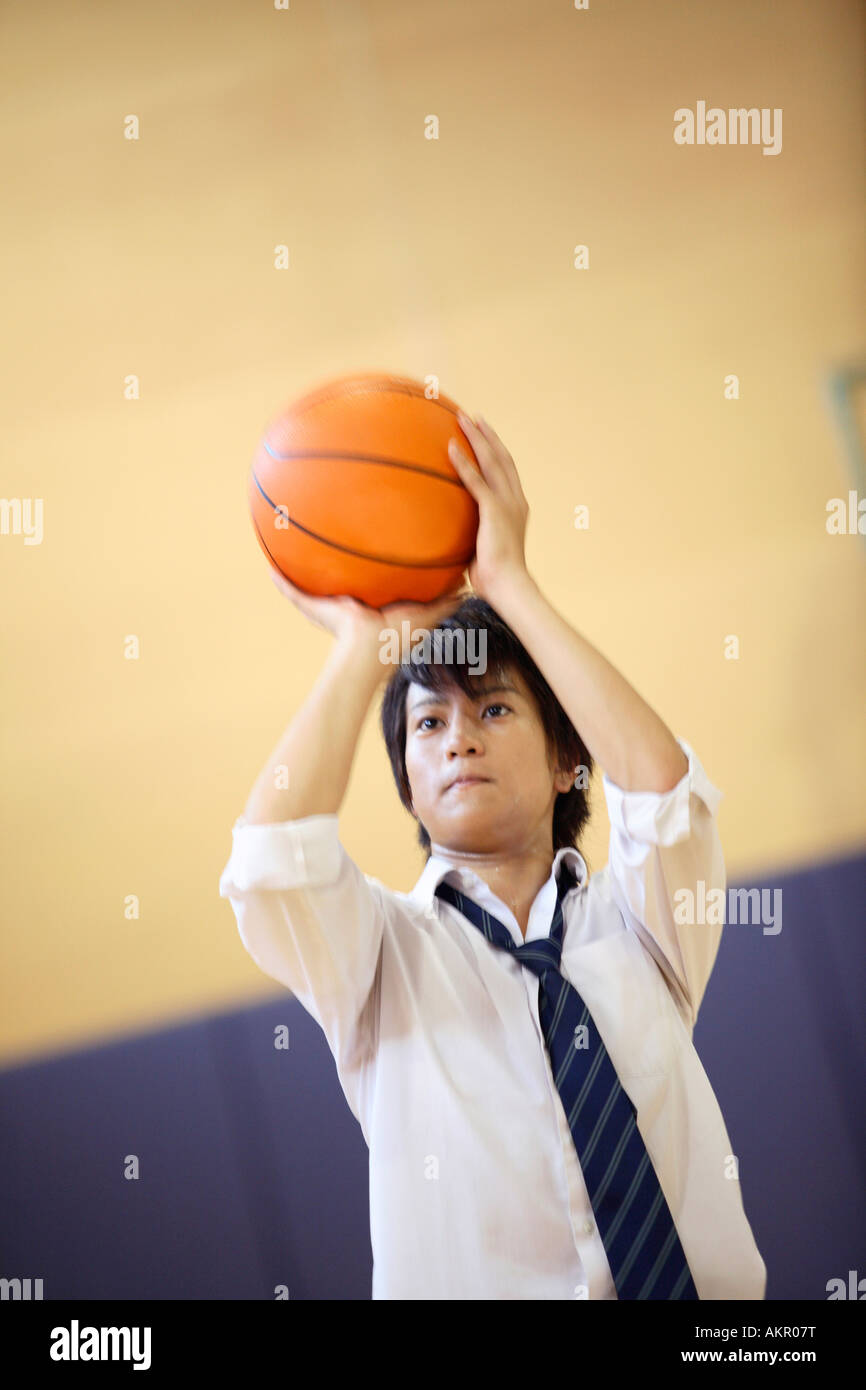 High school student playing basketball Stock Photo - Alamy
