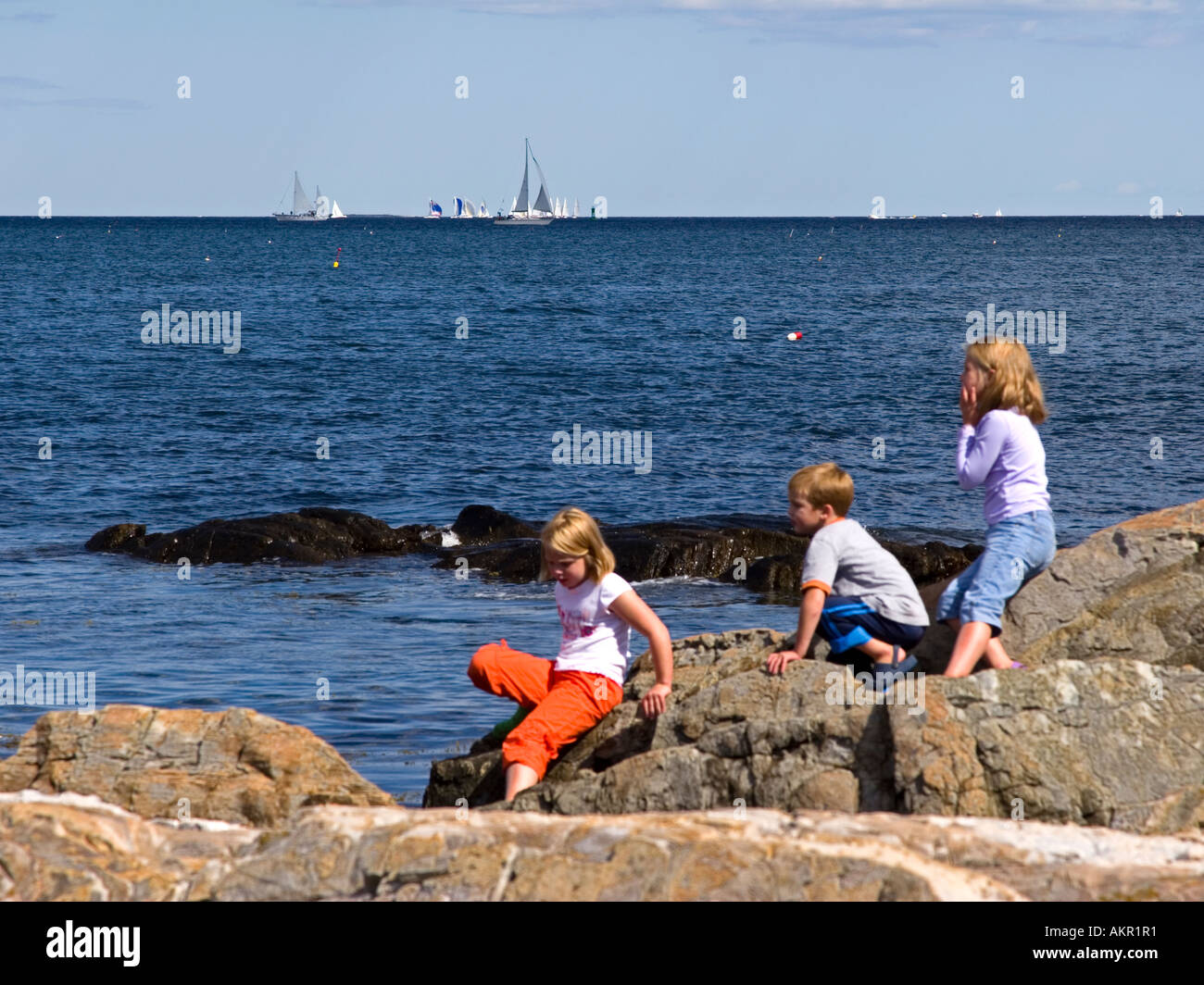 Boy playing on the rocks hi-res stock photography and images - Alamy