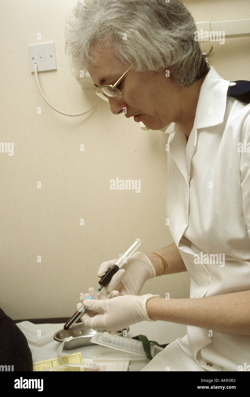 Nurse preparing blood sample for testing Stock Photo - Alamy