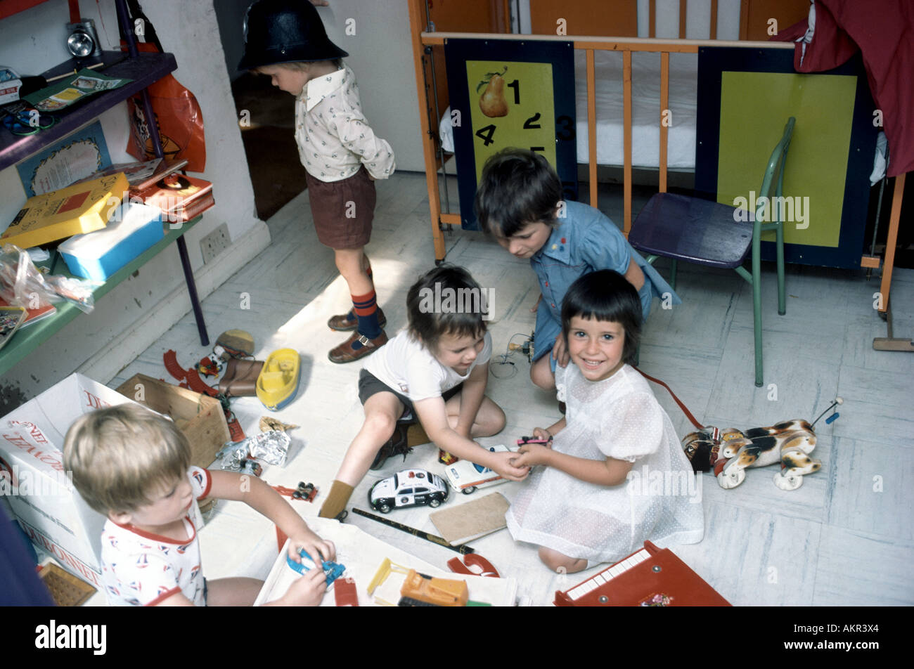 young girls and boys playing with toys in the 1970's Stock Photo - Alamy