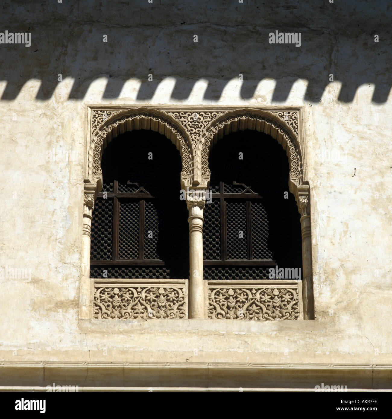Moorish stone carved window with dark carved timber wood grille and ...
