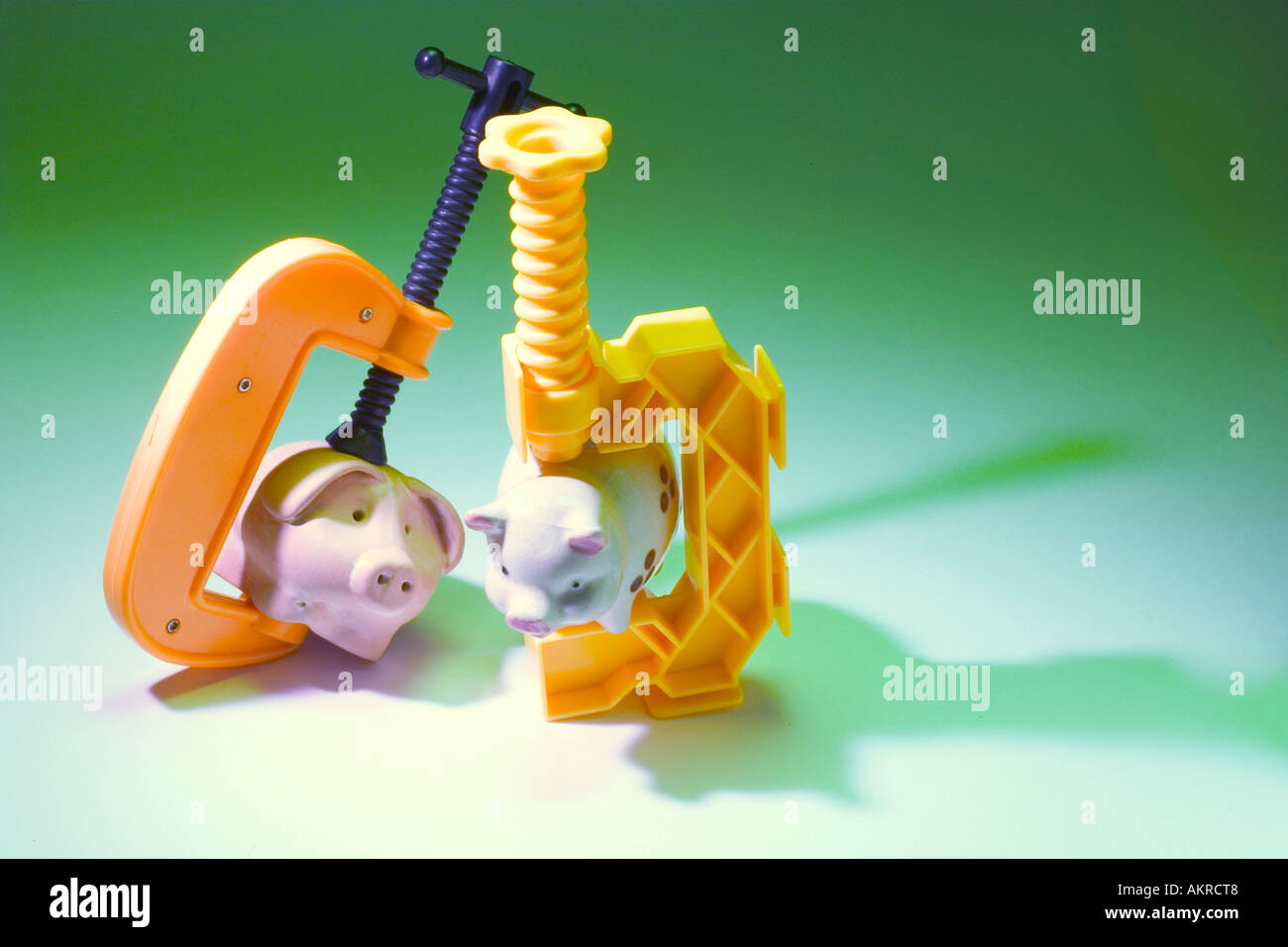 Toy Plastic Clamps with Piggybanks Stock Photo - Alamy