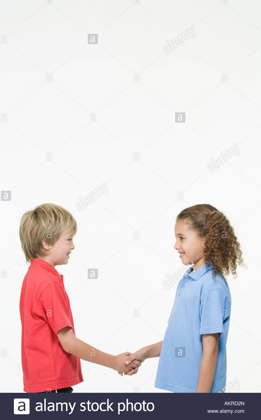 Child Shaking Hands Stock Photos & Child Shaking Hands Stock Images - Alamy