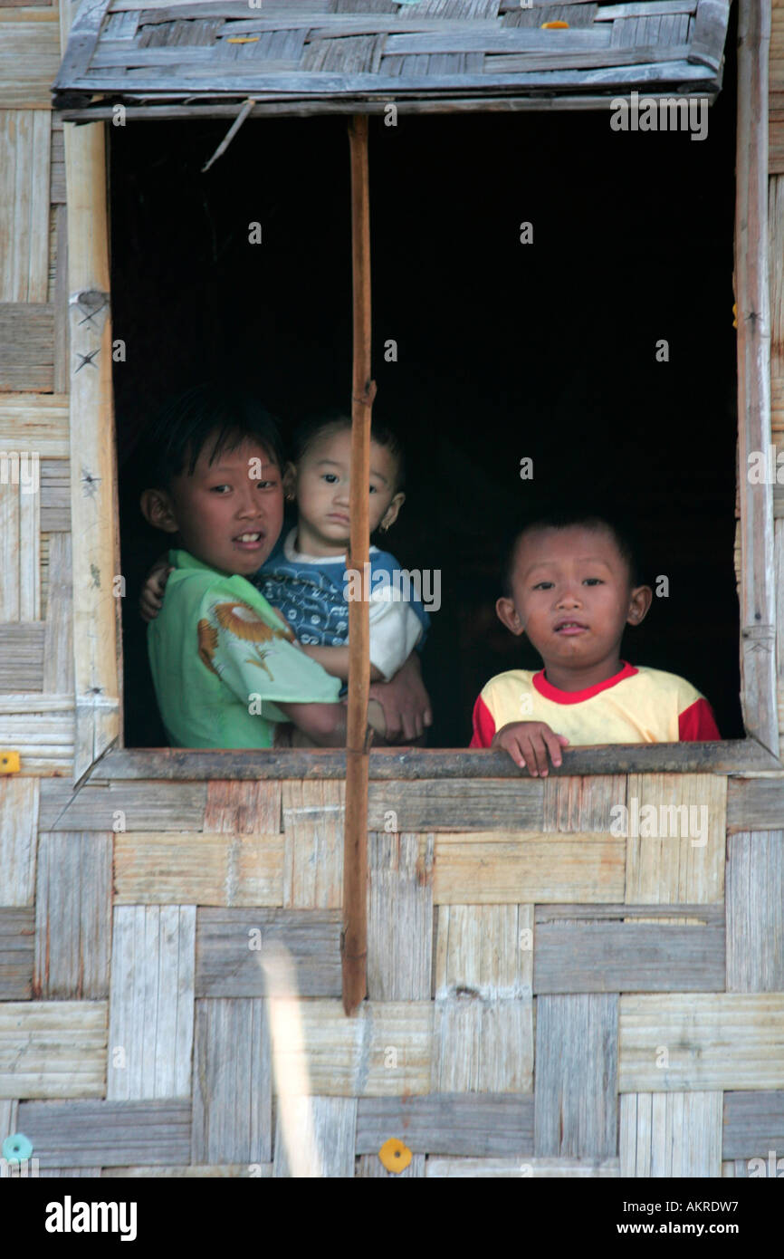 Intha children in a window at a floating village, Inle Lake, Shan State ...