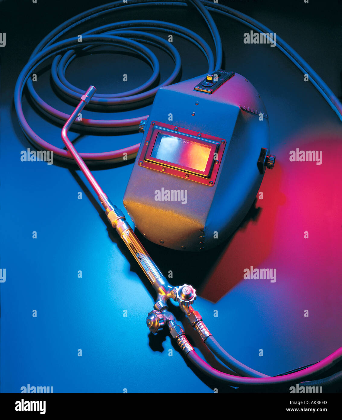 welders mask and torch on blue surface Stock Photo - Alamy